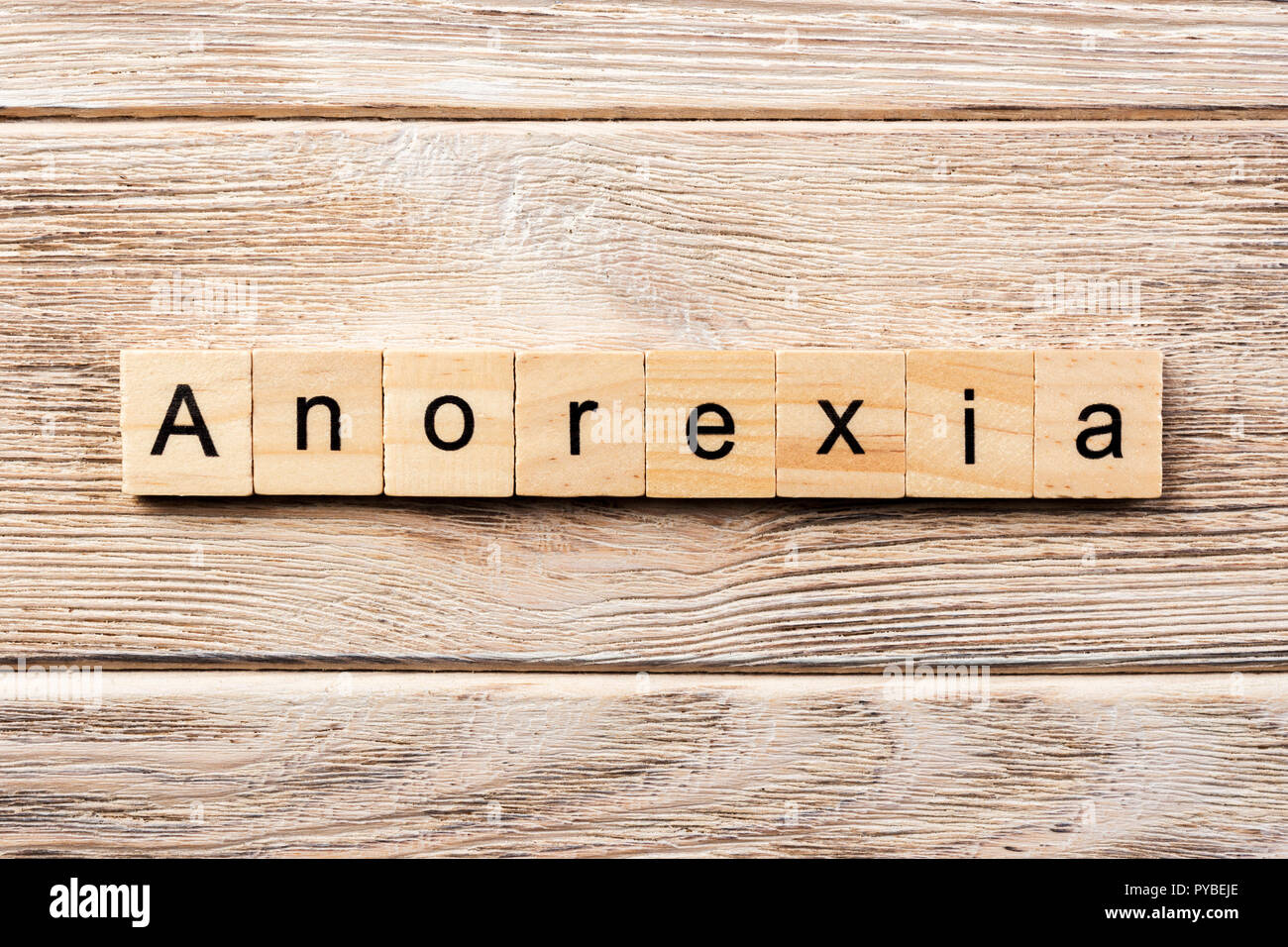 anorexia word written on wood block. anorexia text on table, concept ...
