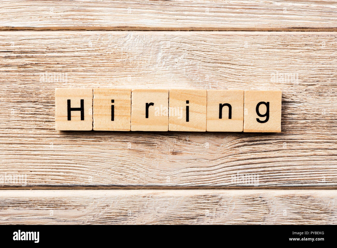 hiring word written on wood block. hiring text on table, concept Stock ...