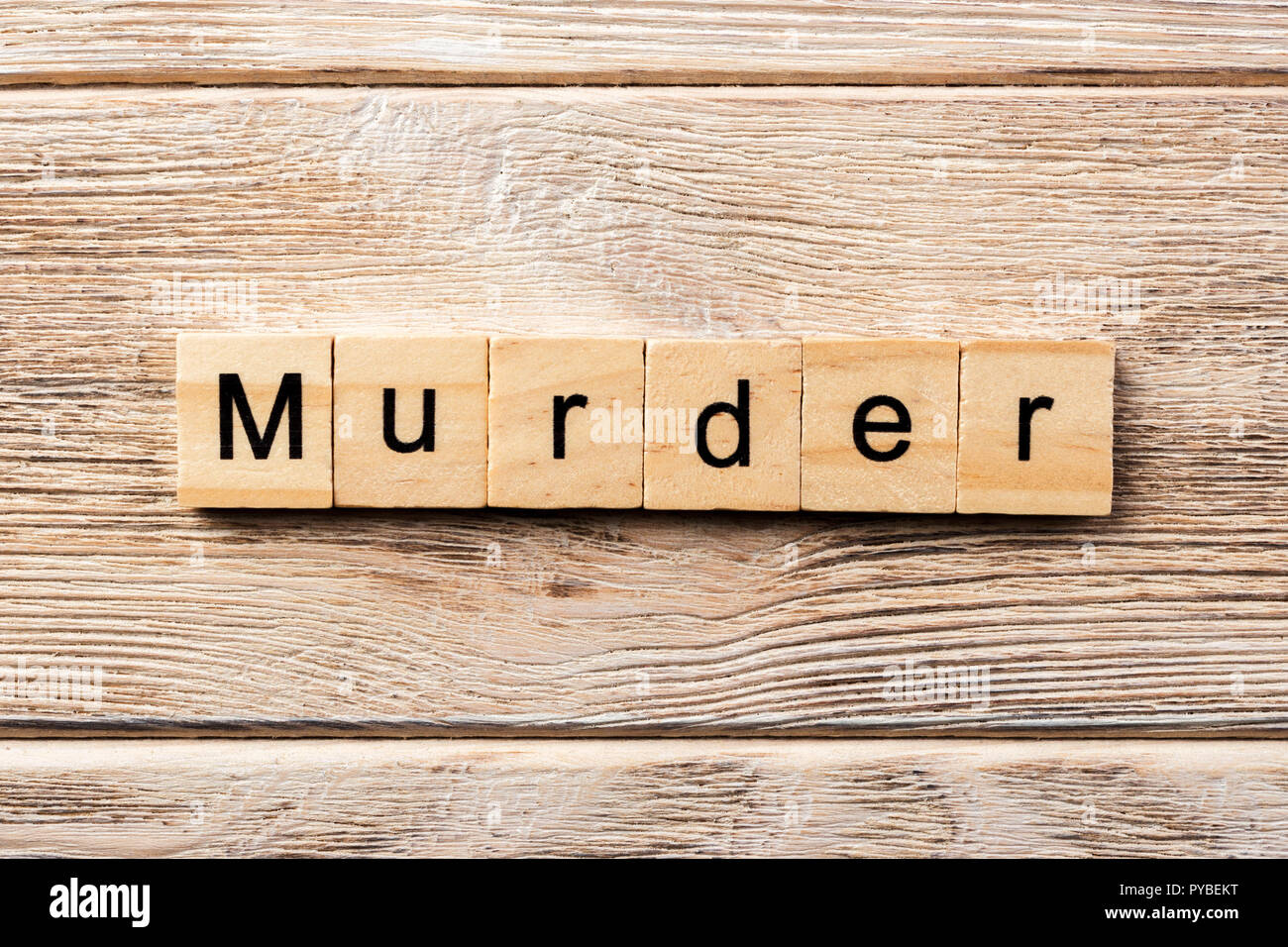 murder word written on wood block. murder text on table, concept Stock ...