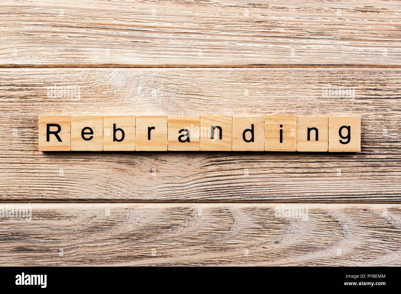 rebranding word written on wood block. rebranding text on table ...