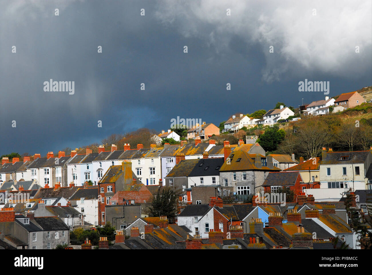 Portland, UK. 26th October 2018. Clouds turn dark over Fortuneswell as ...