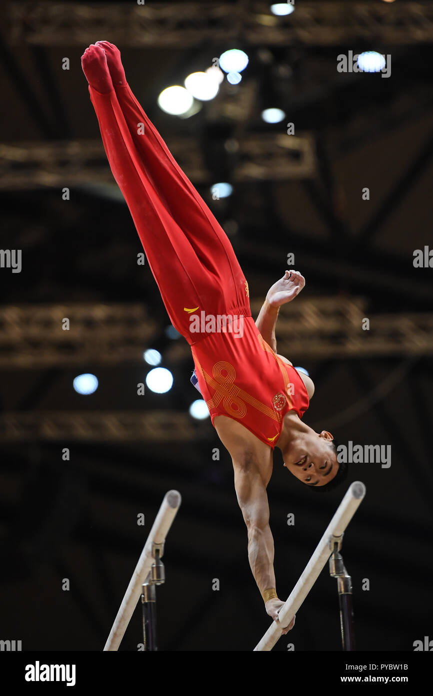 Doha, Qatar. 26th Oct, 2018. ZOU JINGYUAN competes on the parallel bars ...