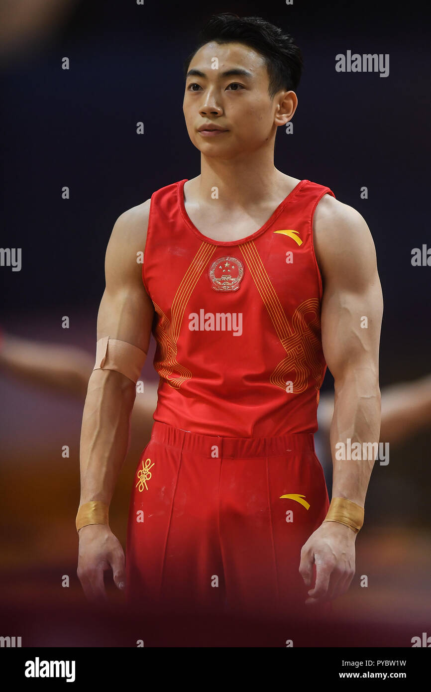Doha, Qatar. 26th Oct, 2018. ZOU JINGYUAN waits for his turn to compete ...