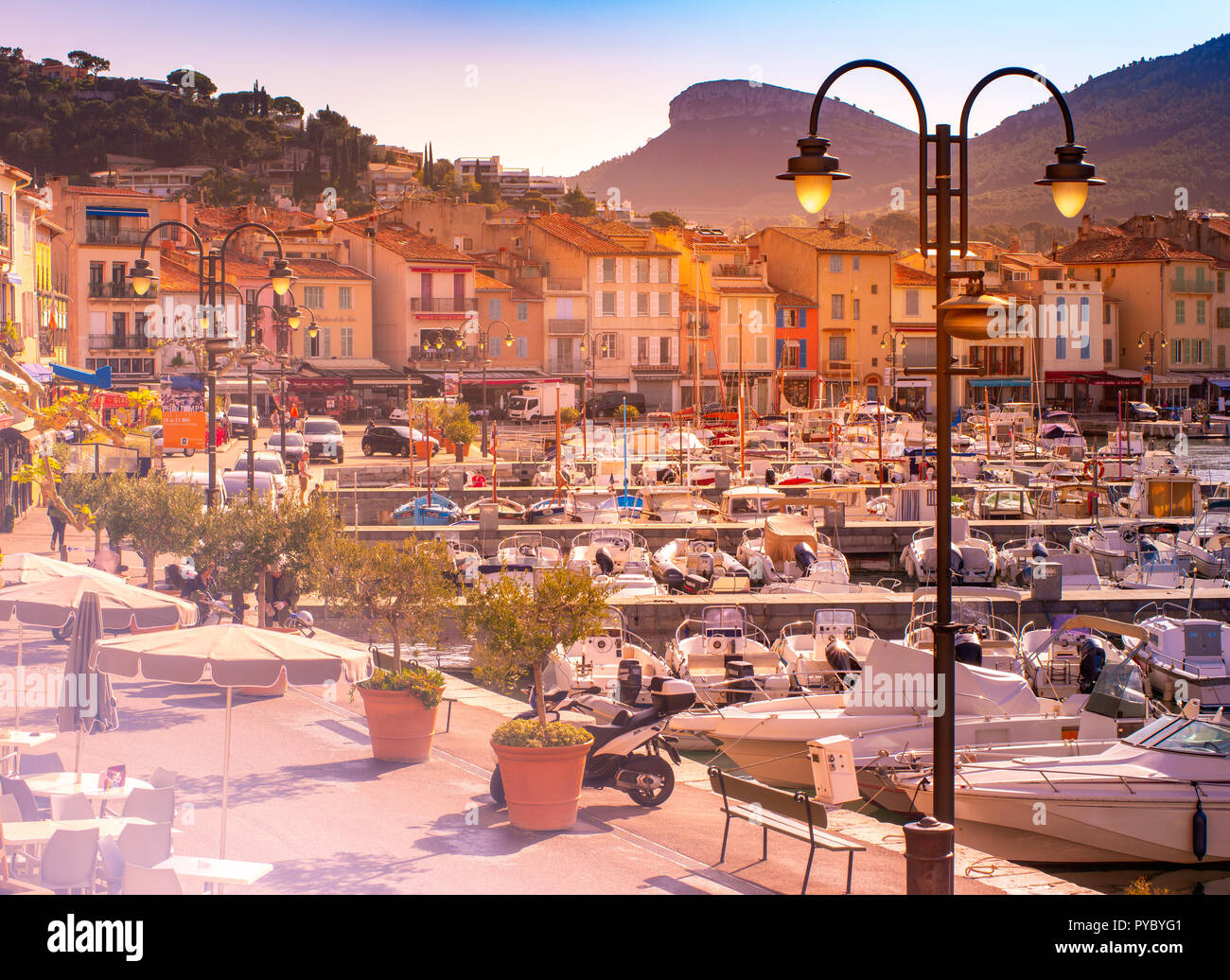 Chateau de Cassis castle on top of hill and close up of boats moored in ...