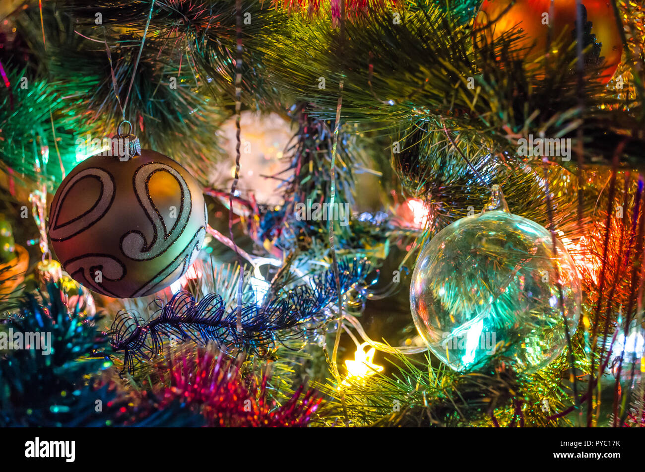 Christmas toys on christmas tree with luminous festoon closeup. New ...