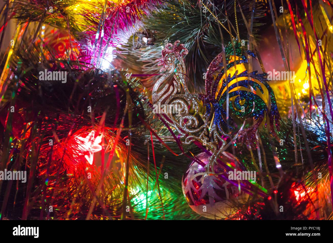 Christmas toys on christmas tree with luminous festoon closeup. New ...