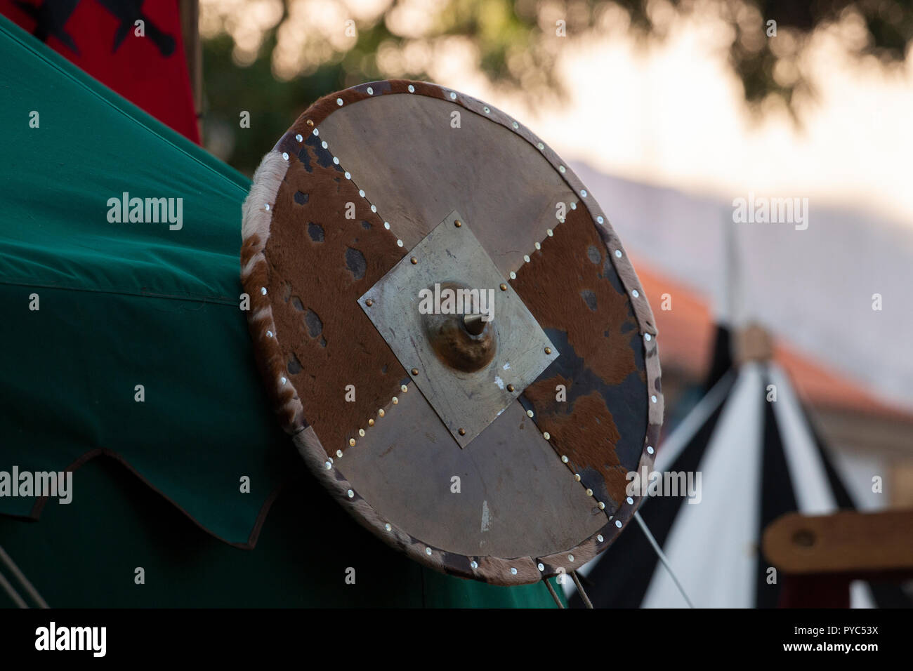 Round medieval wooden shield at display on a fair Stock Photo - Alamy