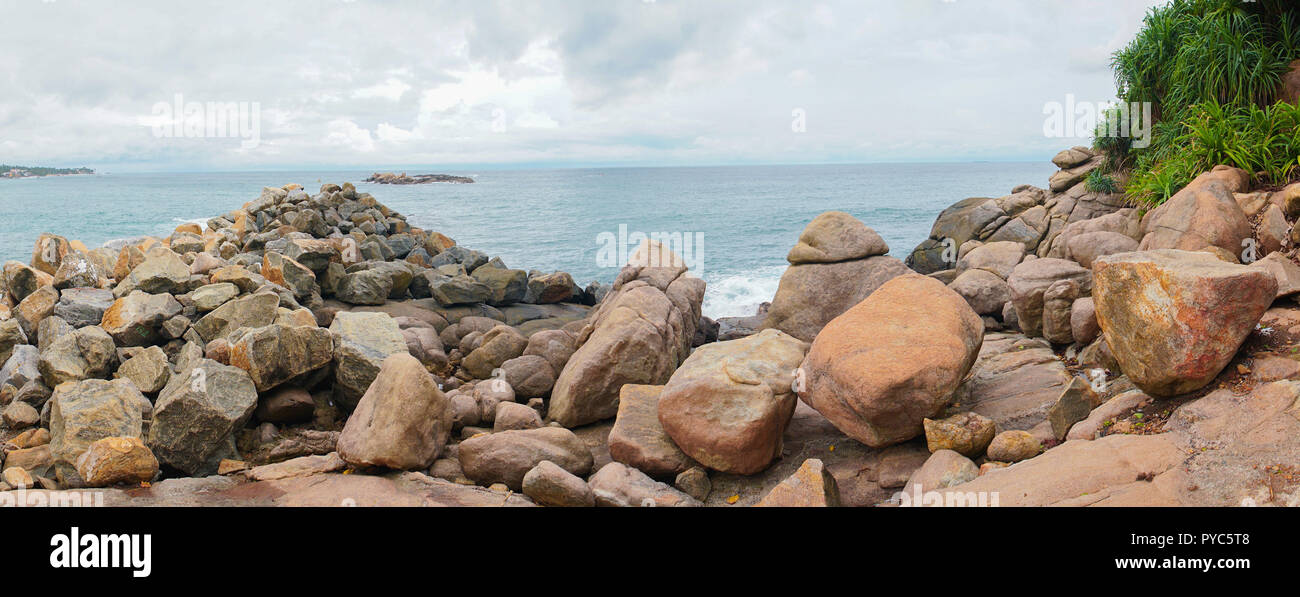 A ridge of rocks in the ocean Stock Photo - Alamy