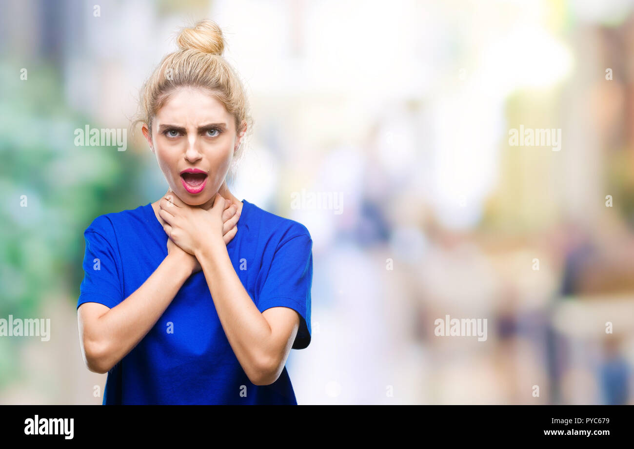 Young beautiful blonde and blue eyes woman wearing blue t-shirt over ...