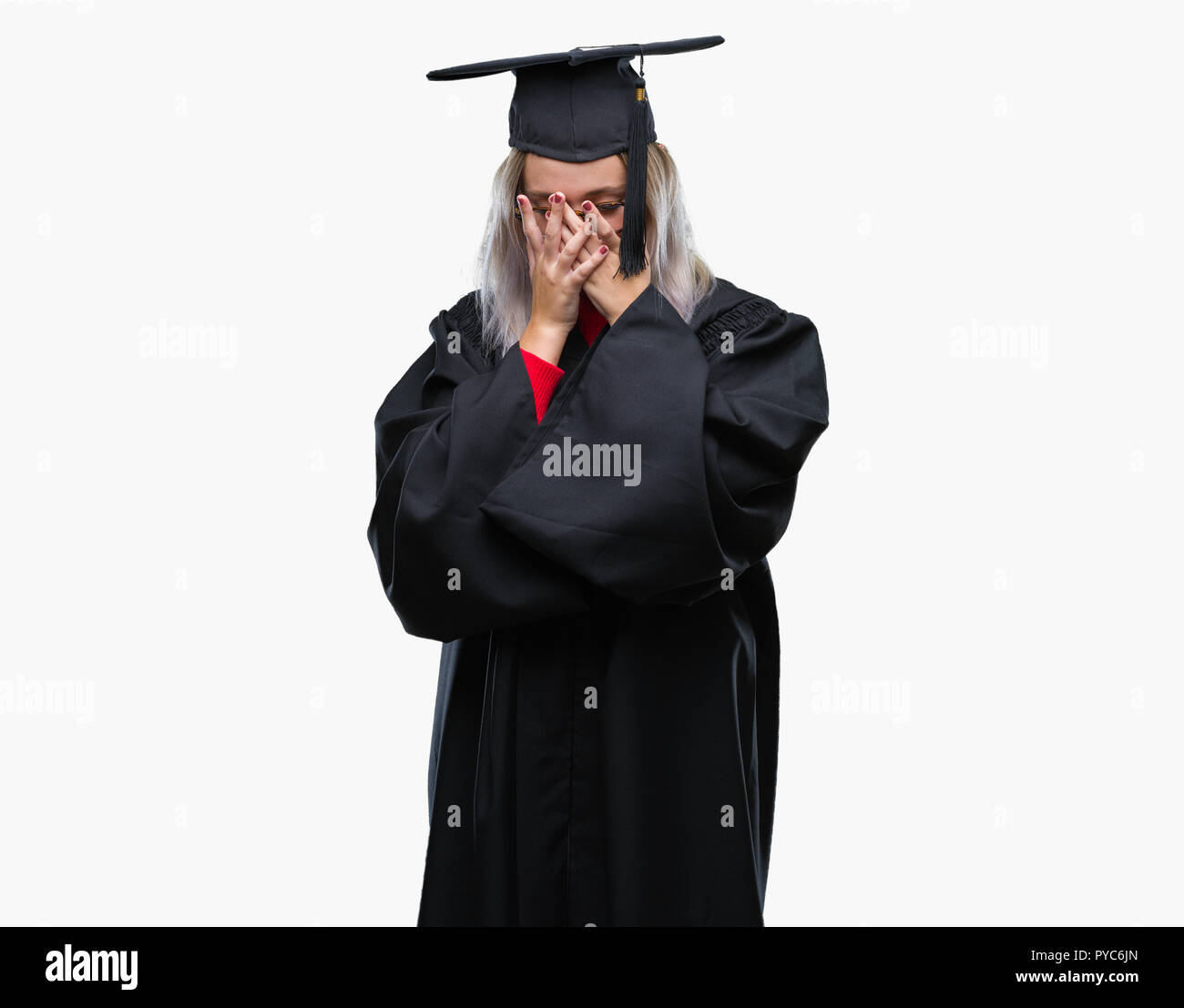 Young blonde woman wearing graduate uniform over isolated background ...