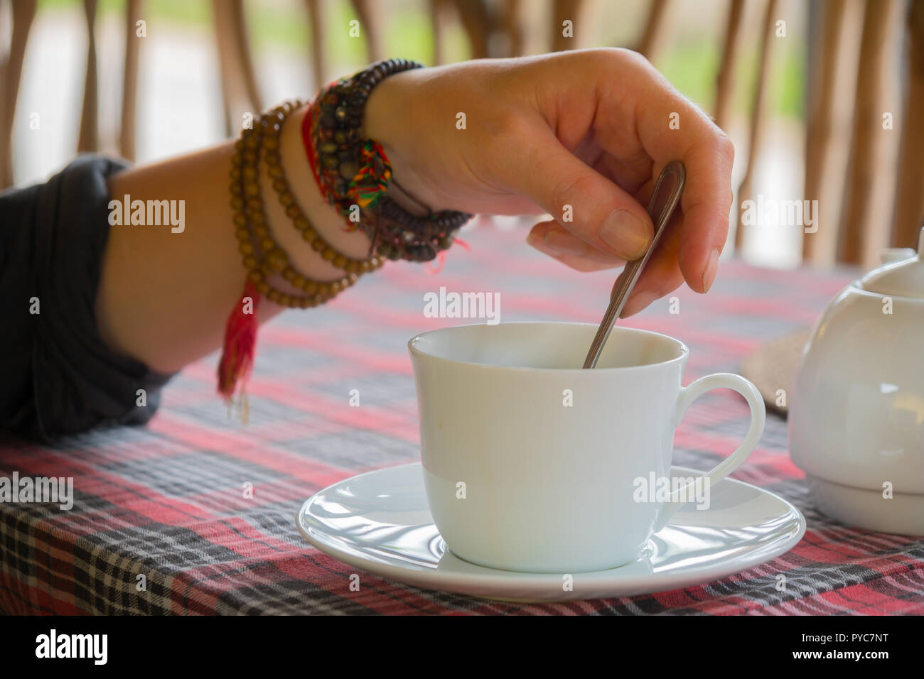Woman stir sugar in cup hi-res stock photography and images - Alamy