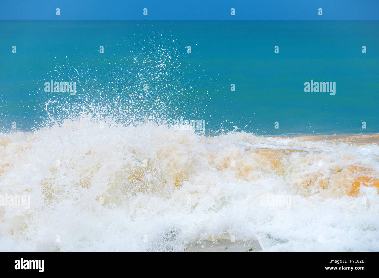 Foam wave, running on the sandy shore Stock Photo - Alamy