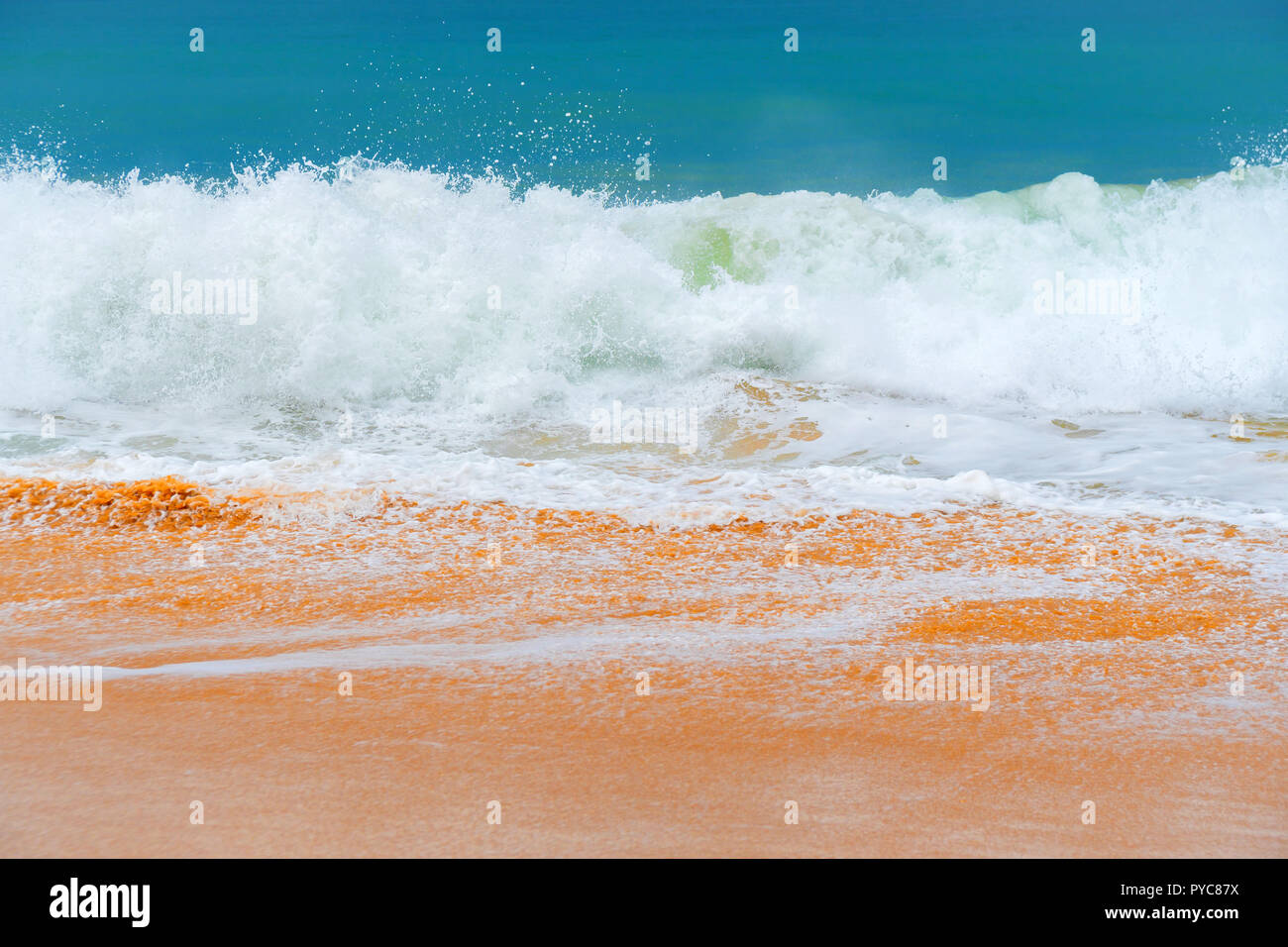 Foam wave, running on the sandy shore Stock Photo - Alamy