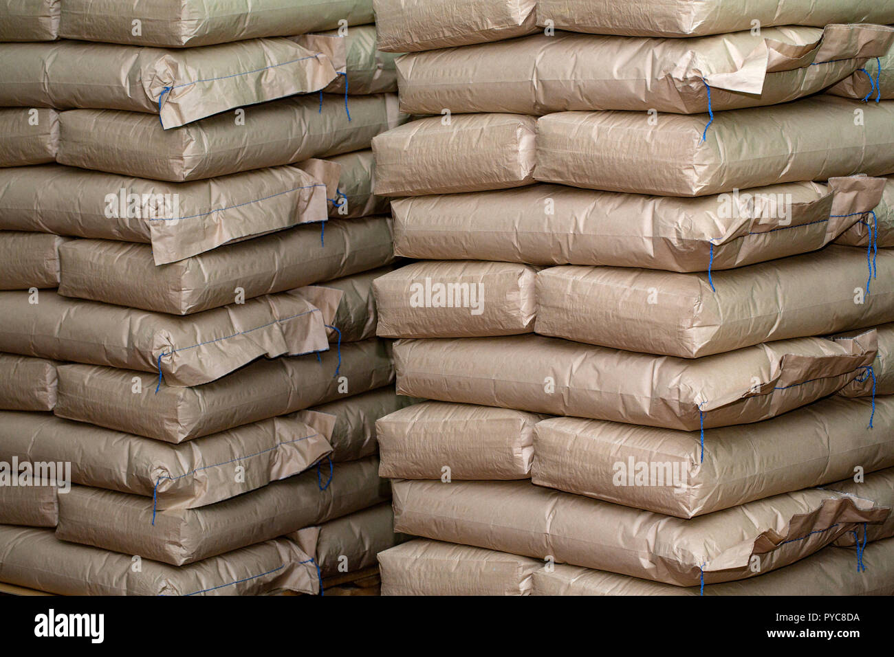 Brown sacks store in industrial warehouse. Background Stock Photo - Alamy