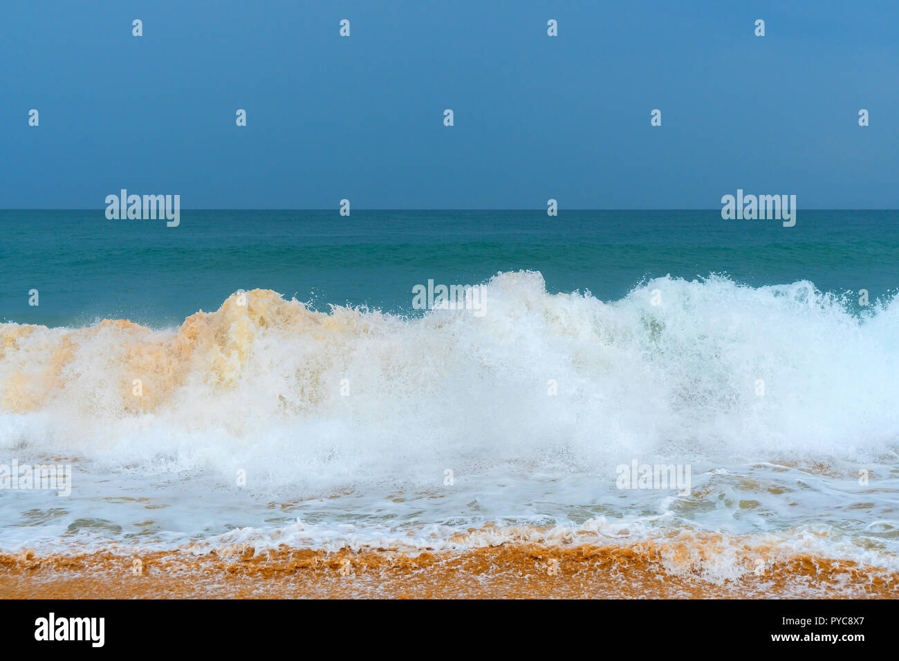 Foam wave, running on the sandy shore Stock Photo - Alamy
