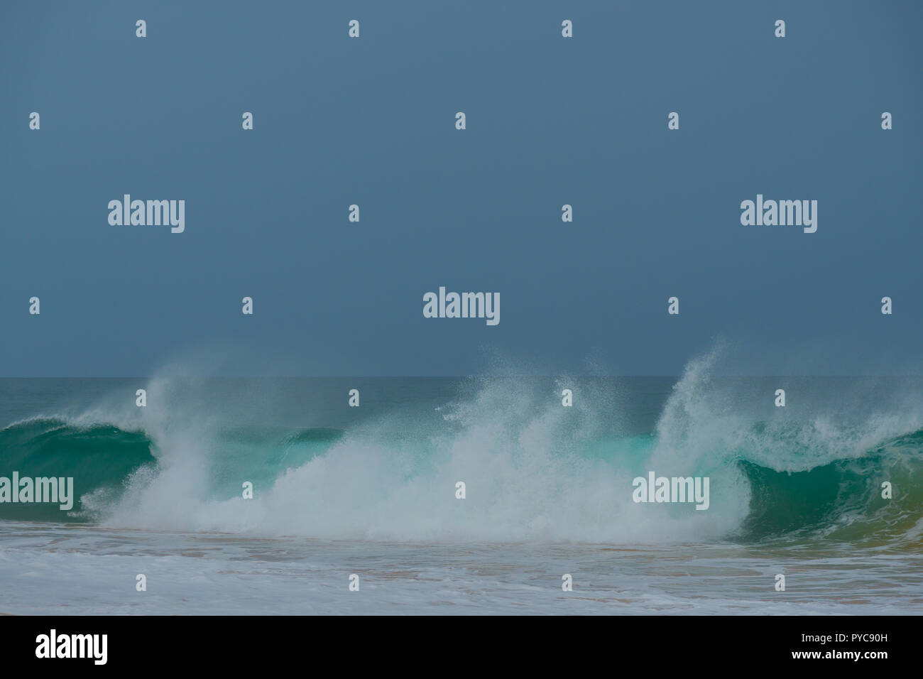 Foam wave, running on the sandy shore Stock Photo - Alamy