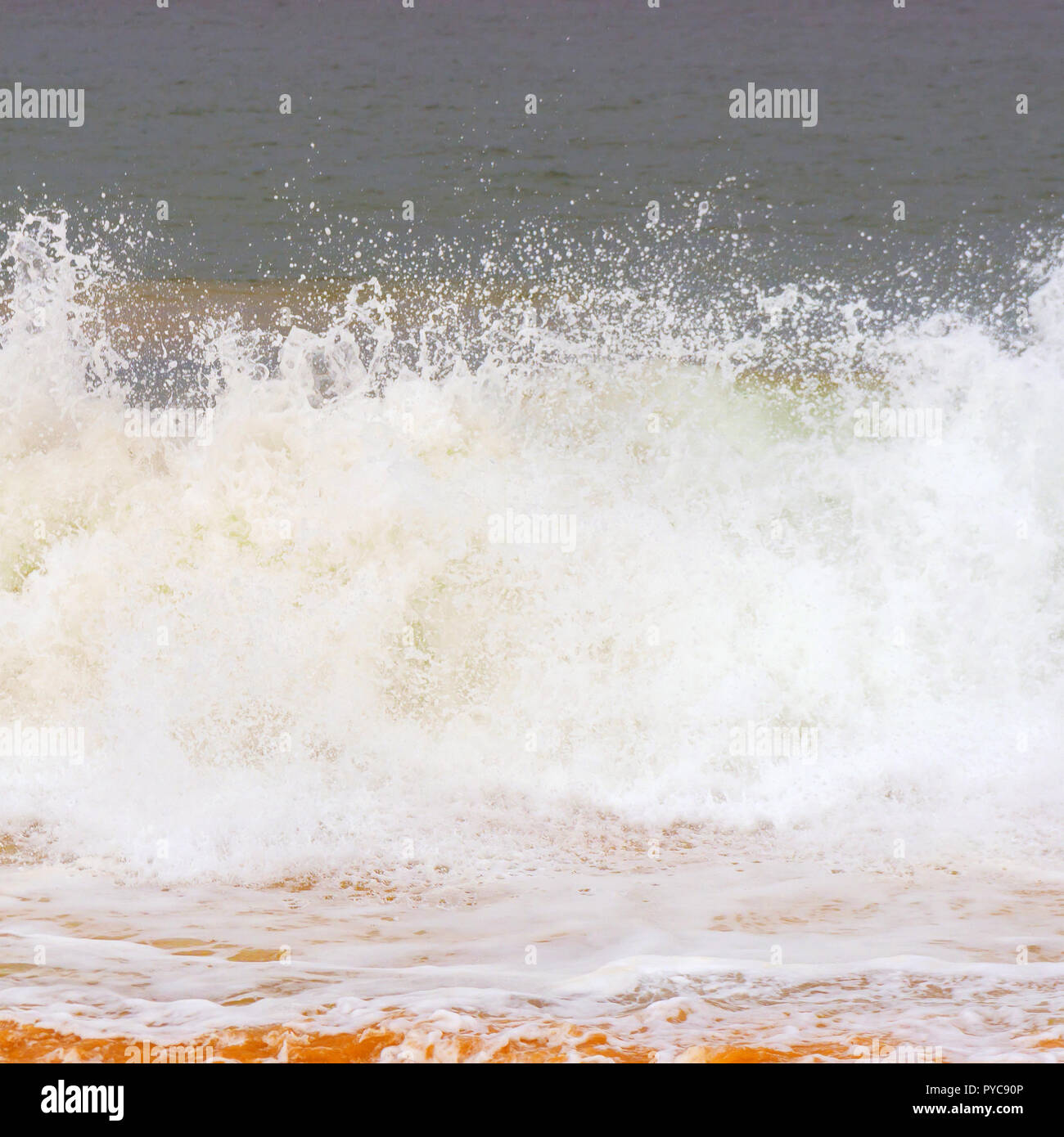 Foam wave, running on the sandy shore Stock Photo - Alamy