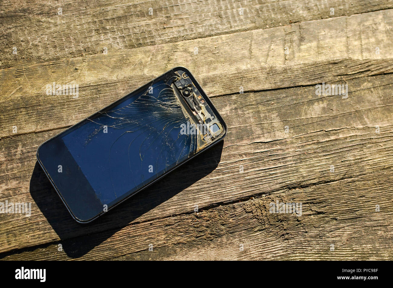 Mobile smartphone with broken screen isolated on white background with ...