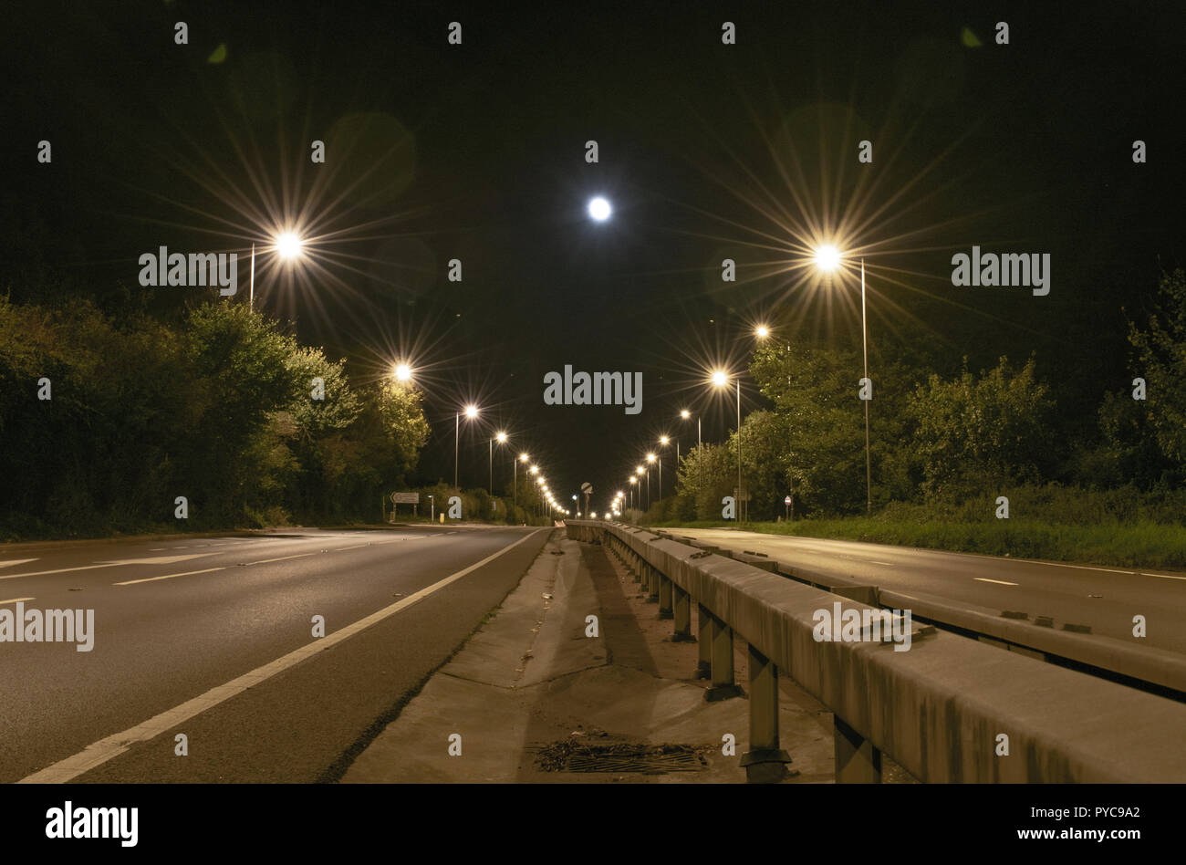 Full Moon above the road Stock Photo - Alamy
