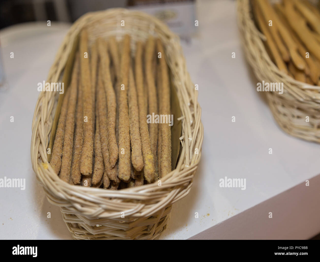 Long Crispy Breadsticks inside a Wicker Basket Stock Photo - Alamy