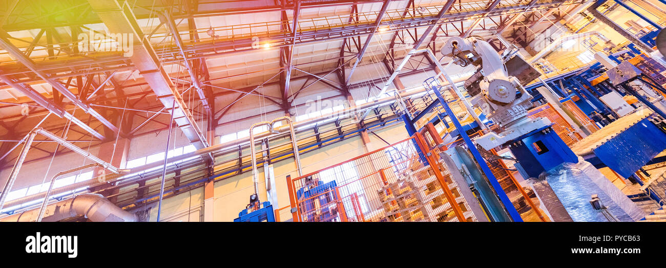 Fiberglass production industry equipment at manufacture background ...