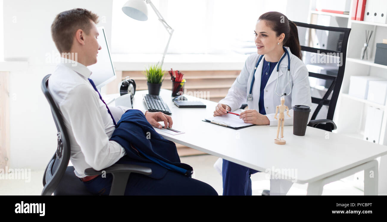 The young man came to see the doctor Stock Photo - Alamy