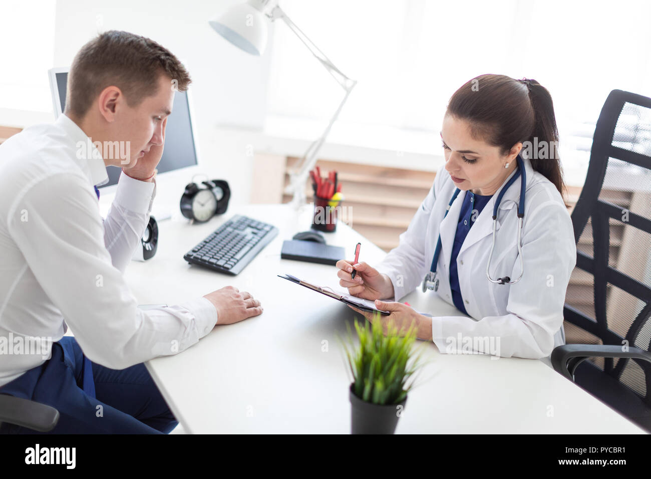 The young man came to see the doctor Stock Photo - Alamy
