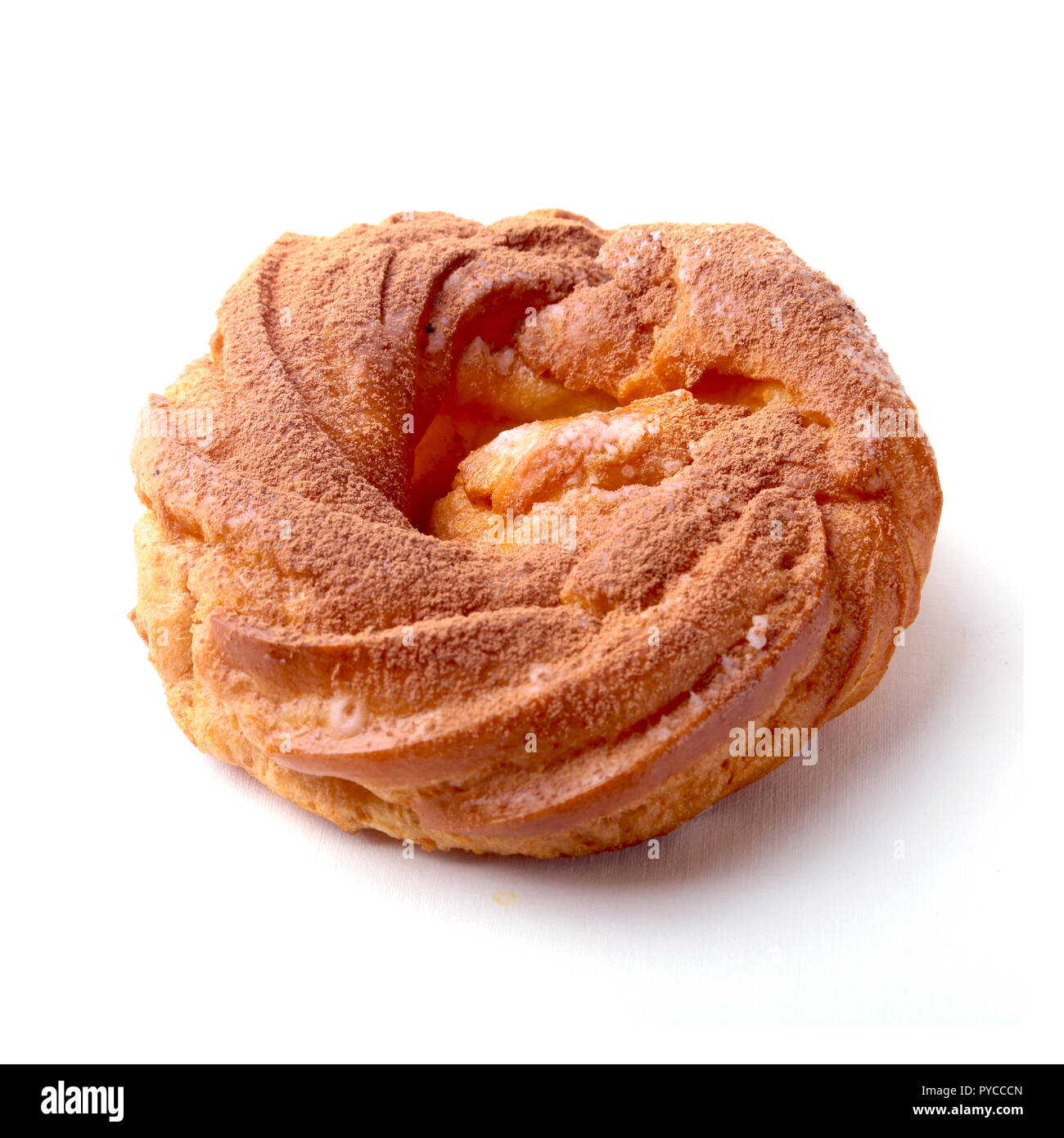 Chocolate and powdered sugar cream puff rings, choux pastry. Isolated ...