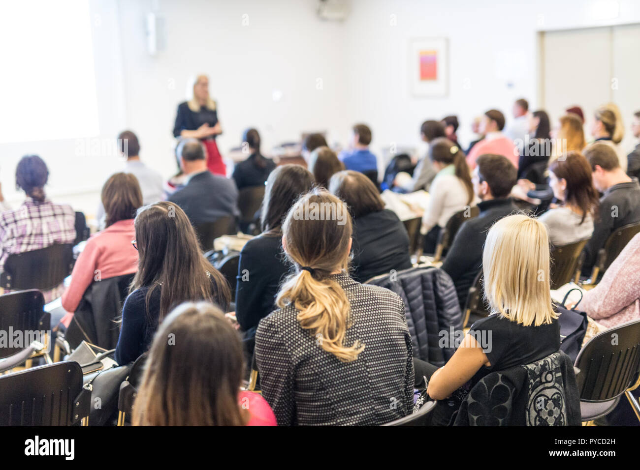 Woman giving presentation on business conference workshop Stock Photo ...