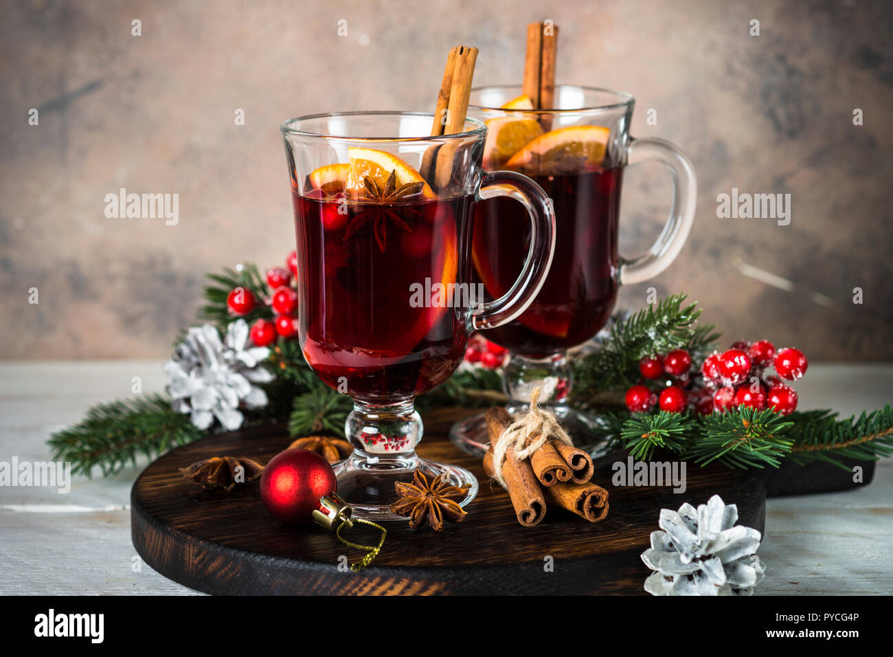 Mulled wine in glass mug with fruit and spices Stock Photo - Alamy