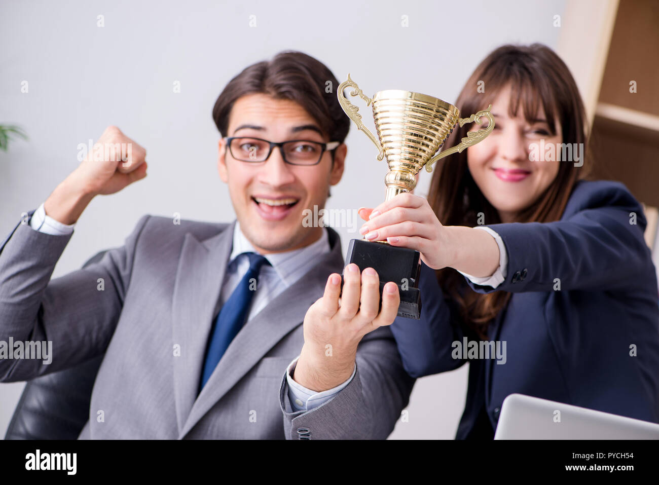 Concept of teamwork with prize Stock Photo - Alamy