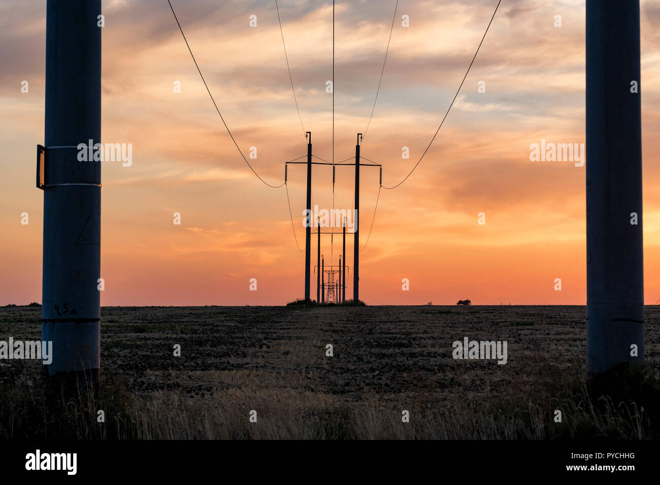 Rural landscape with power poles at sunrise Stock Photo - Alamy