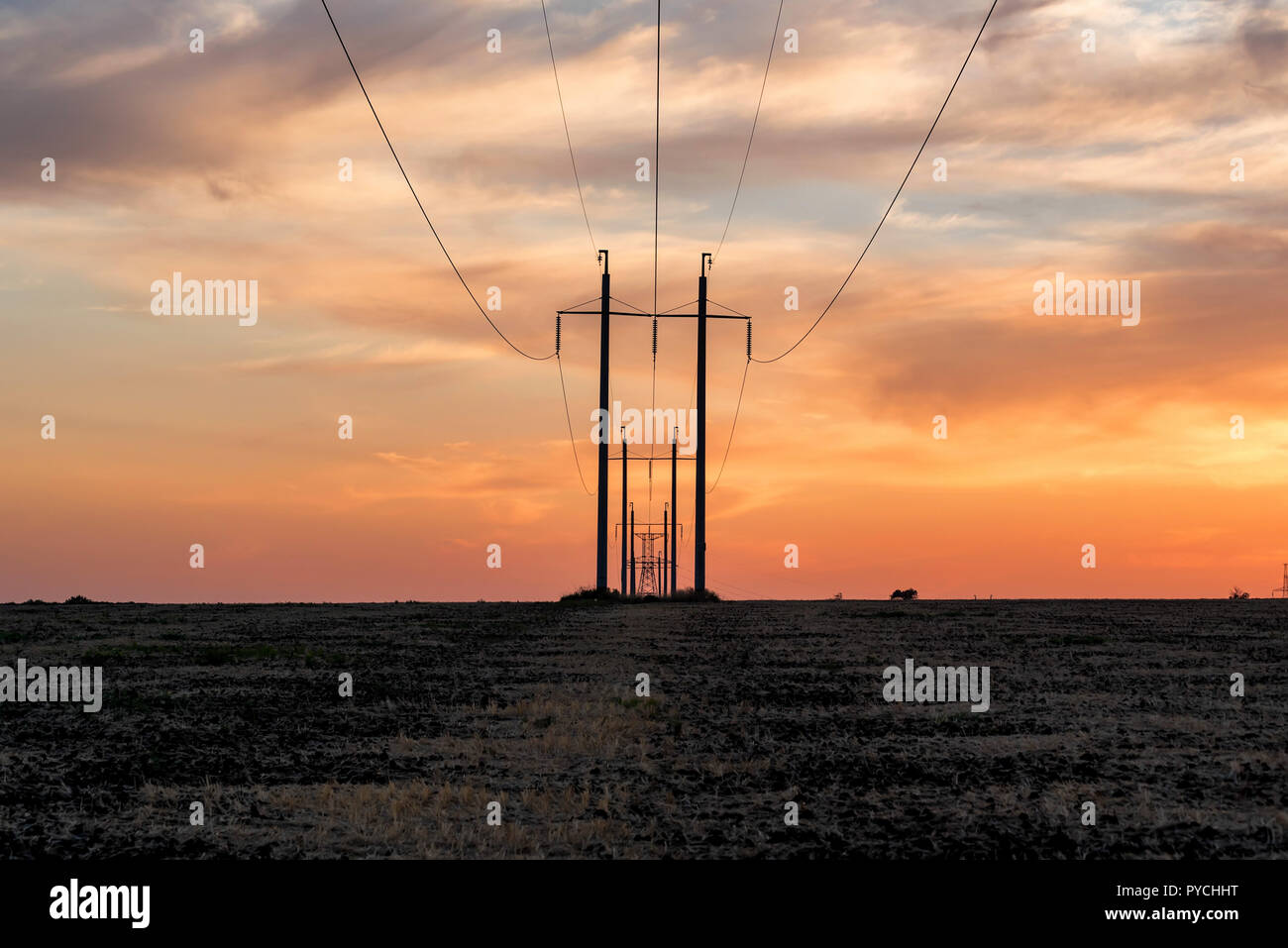 Rural landscape with power poles at sunrise Stock Photo - Alamy