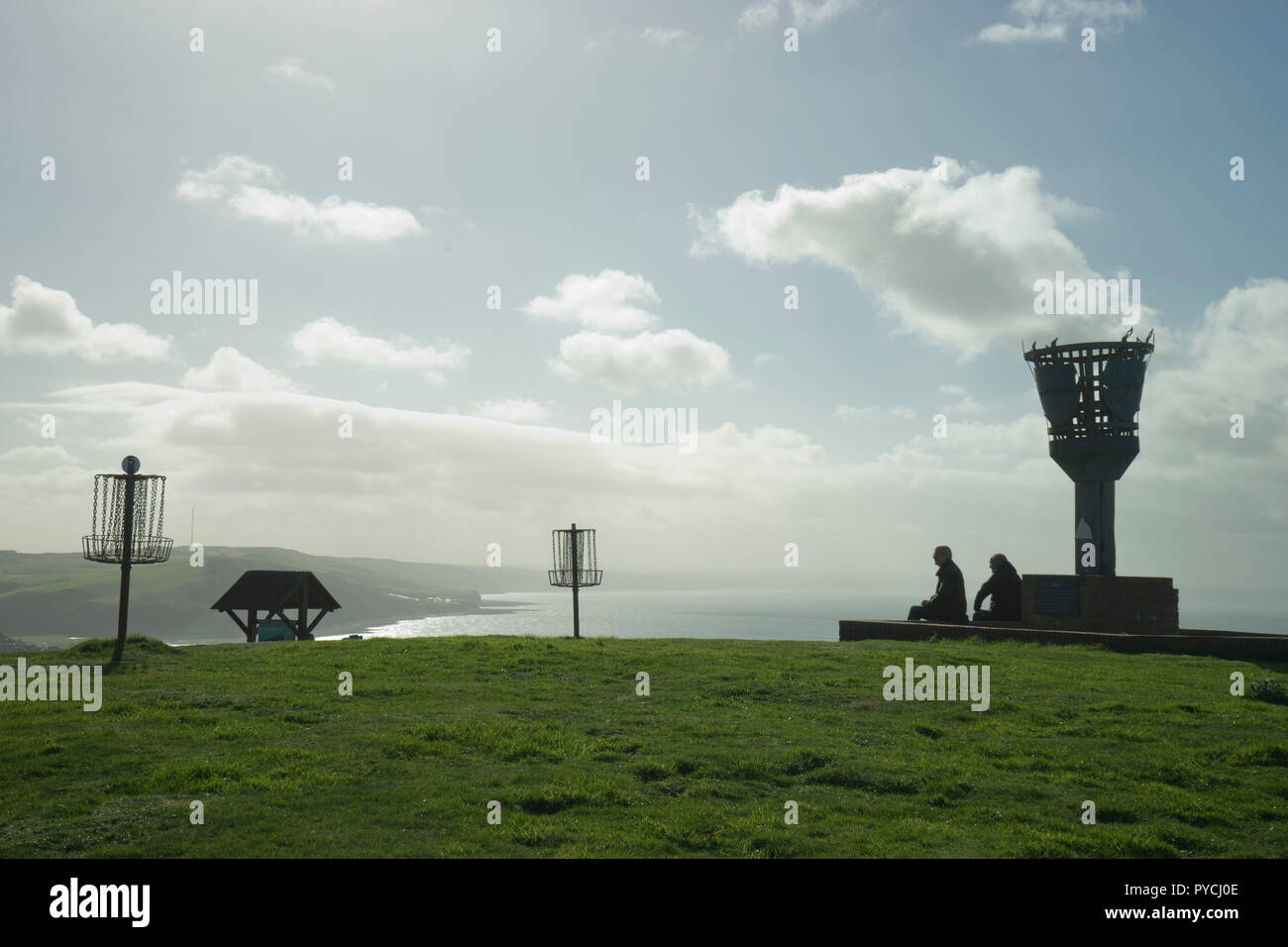 People resting by mini golf course along the Coastal path on Cardigan ...