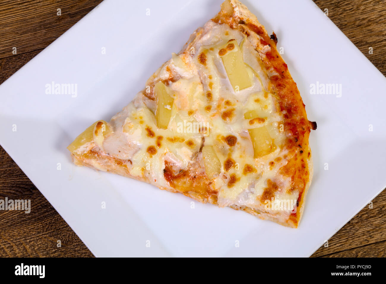 Pineapple pizza with soft cheese Stock Photo - Alamy