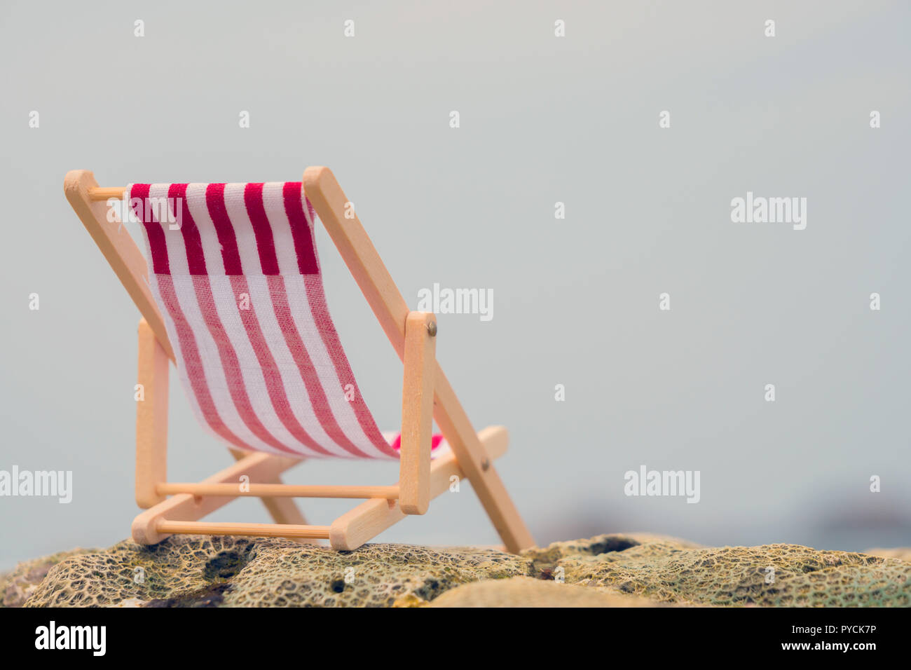 Striped red beach chair Stock Photo - Alamy