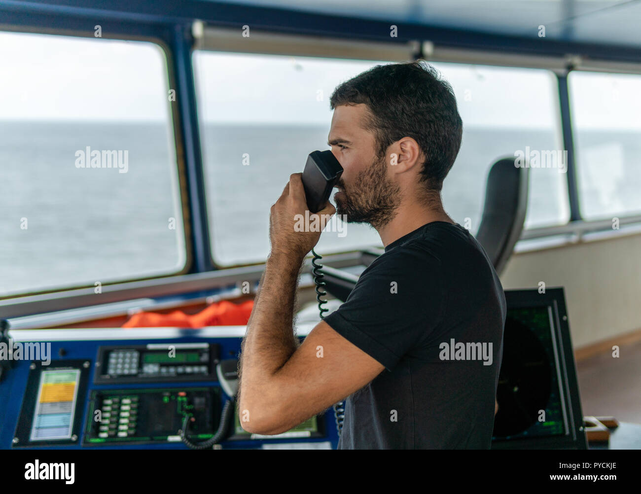 Marine navigational officer is reporting by VHF radio Stock Photo - Alamy