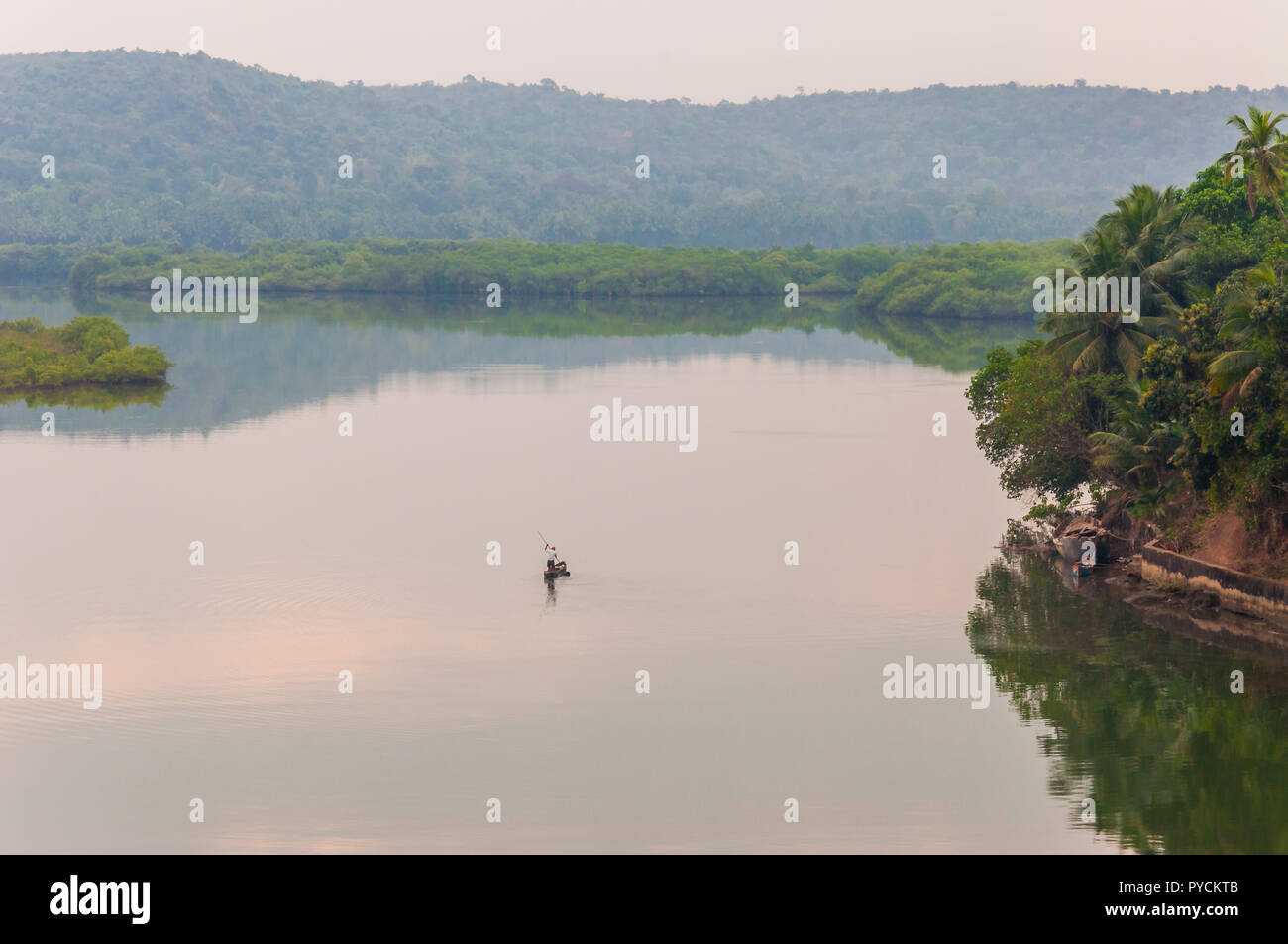 Here you can see the fisherman on a paddle boat floating down the river ...