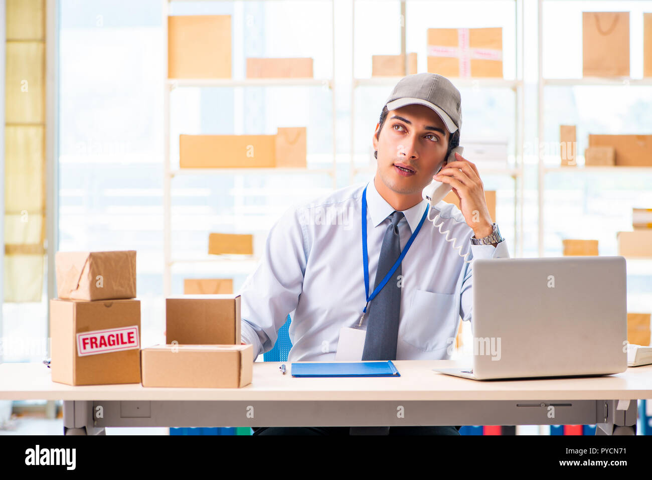 Male employee working in box delivery relocation service Stock Photo ...
