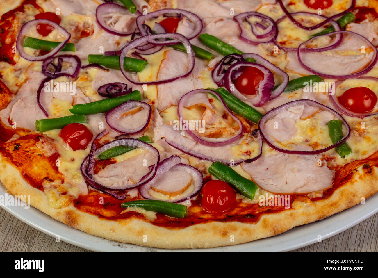 Pizza with ham and cheese Stock Photo - Alamy