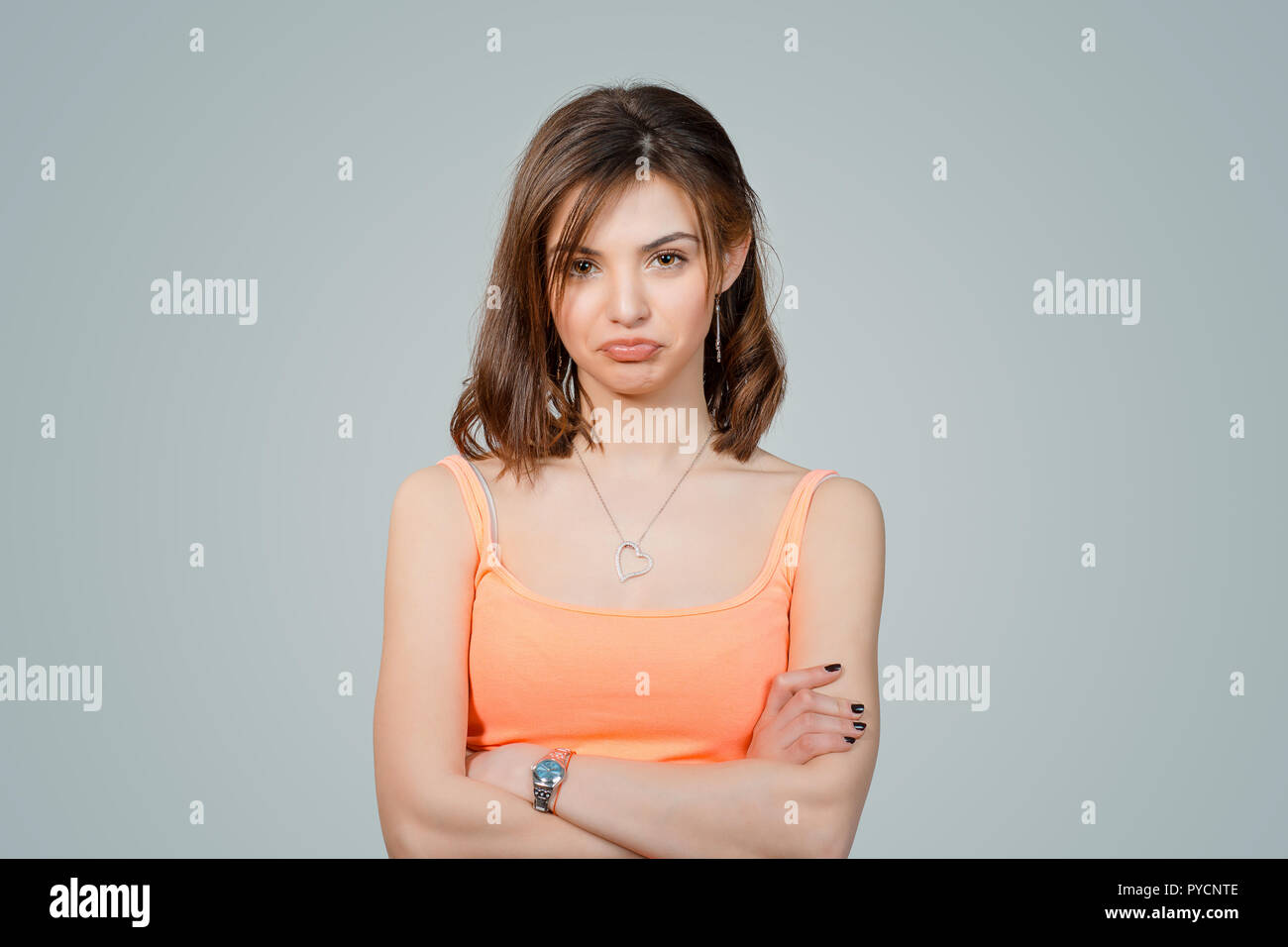 Upset woman with displeased face expressionarms crossed isolated on ... Upset woman with displeased face expressionarms crossed isolated on ...