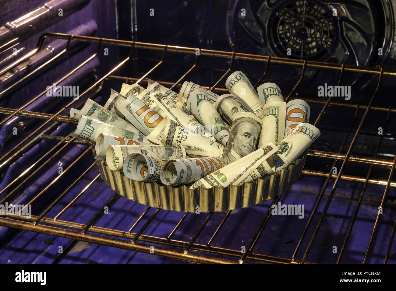 baking $100 bill money pie in oven Stock Photo - Alamy