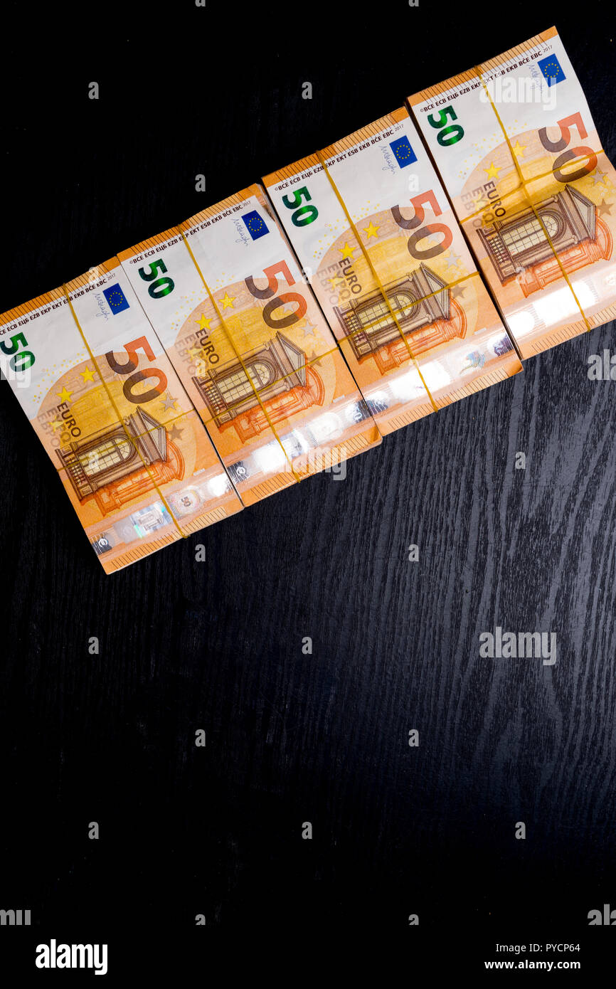 Pile of 50 real euro notes 50-euro banknotes under rubber band ...