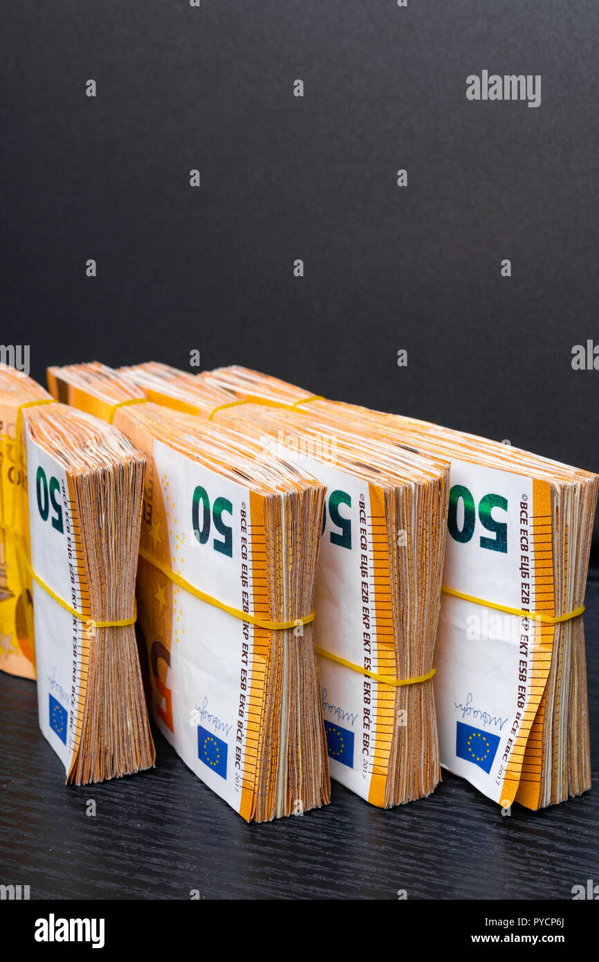 Pile of 50 real euro notes 50-euro banknotes under rubber band ...