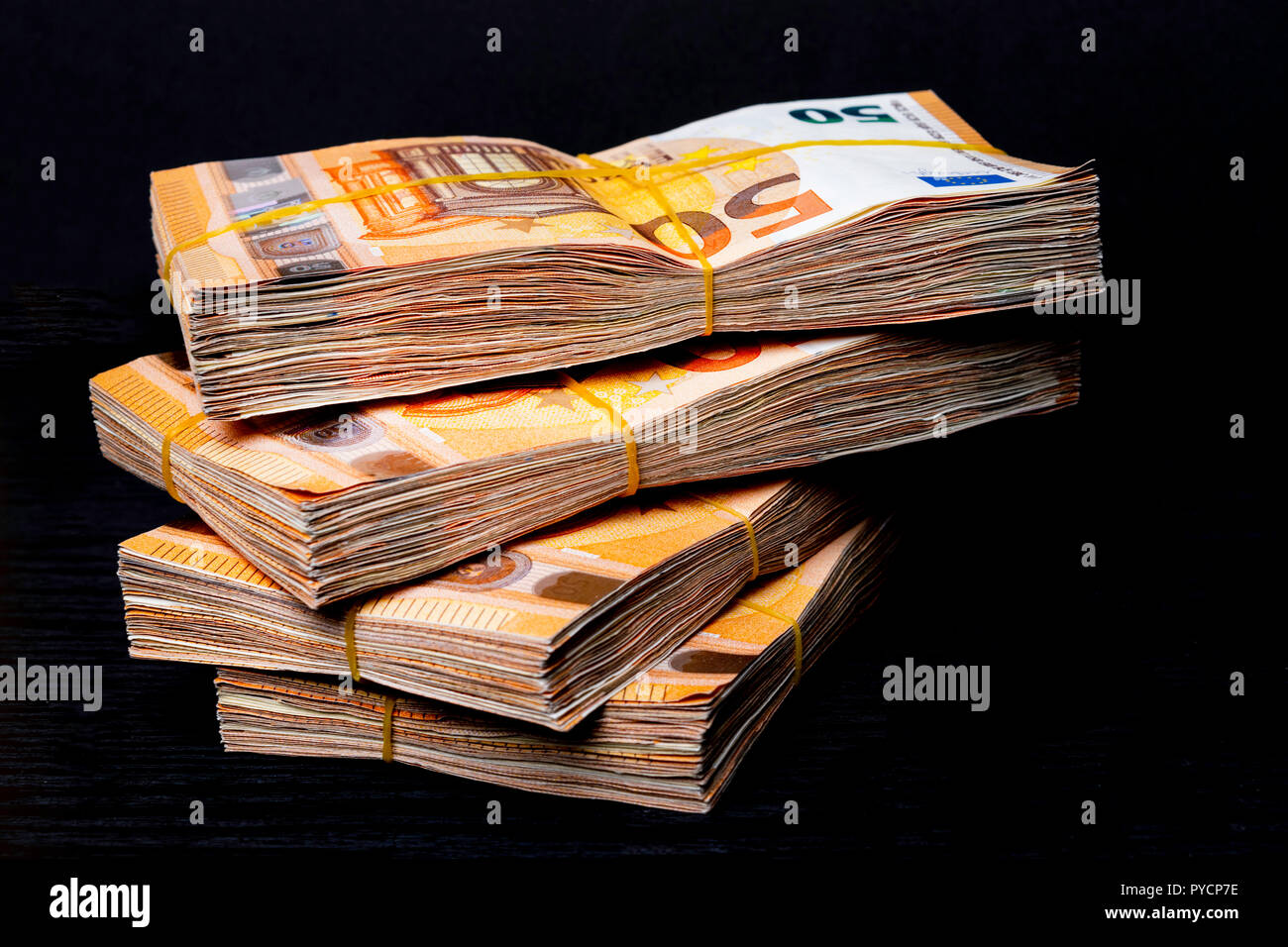 Pile of 50 real euro notes 50-euro banknotes under rubber band ...