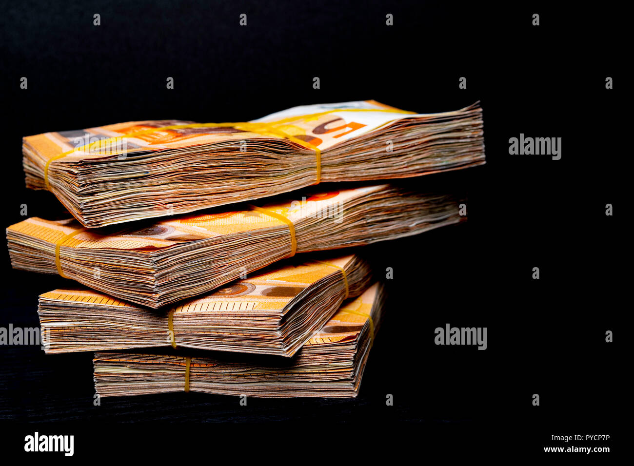 Pile of 50 real euro notes 50-euro banknotes under rubber band ...