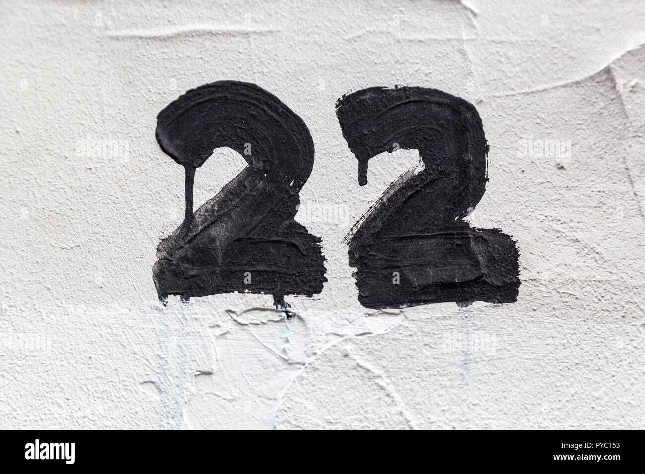 House number twenty-two 22 painted black on white render in rouch basic ...