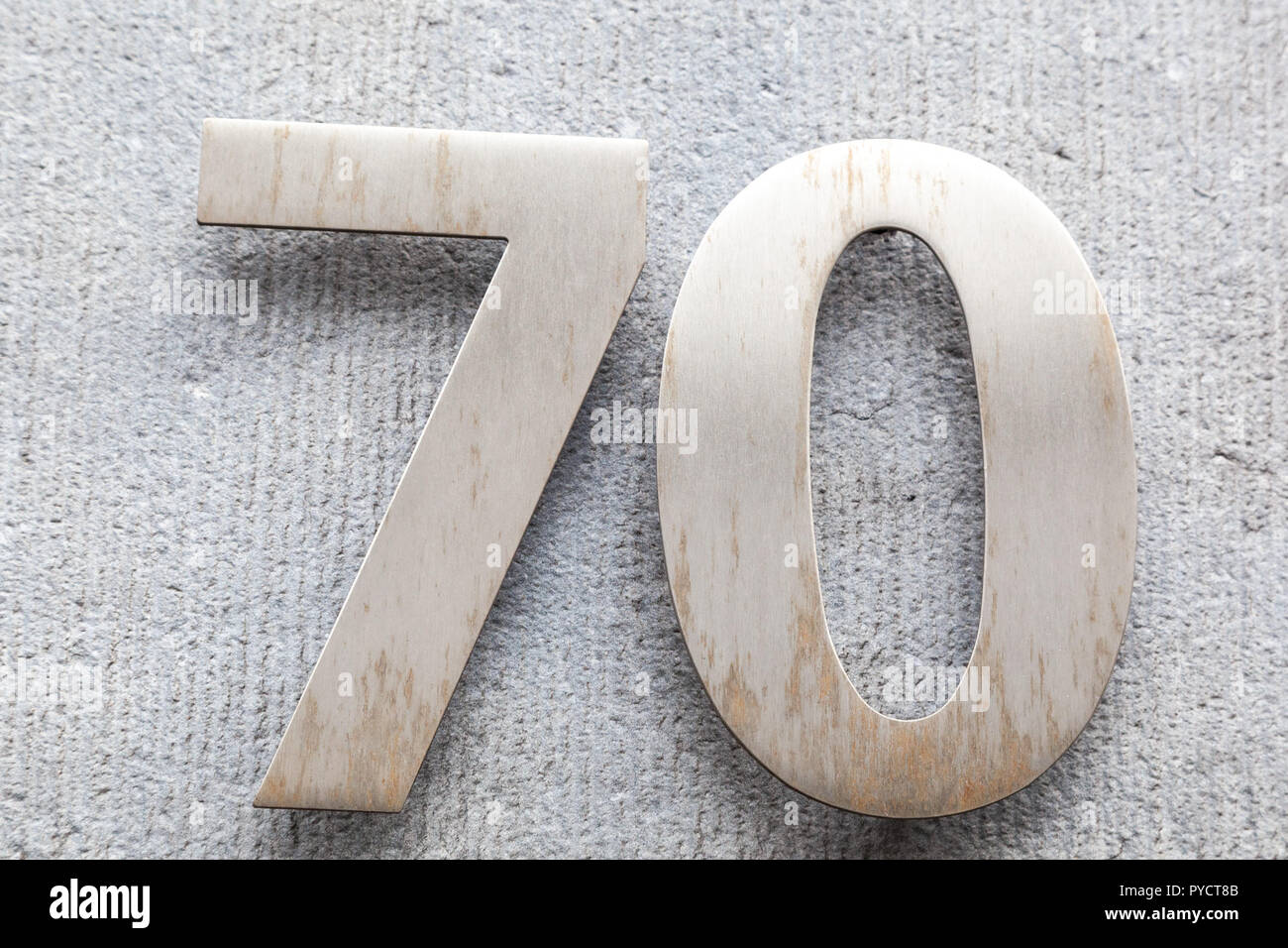 House number seventy 70 in cut out metal - stainless steel, in designer ...