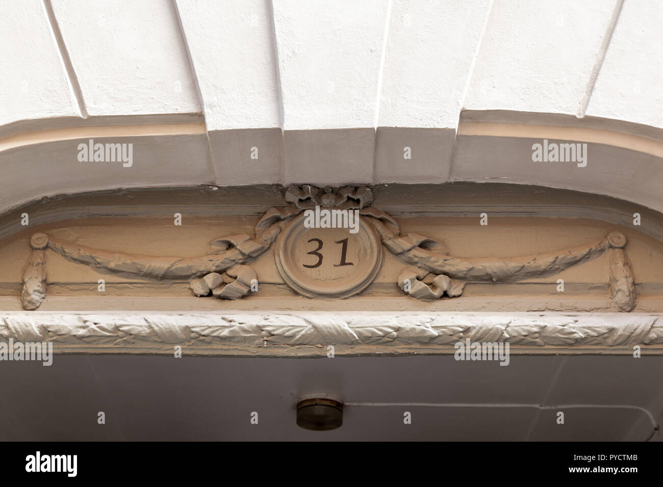 House number thirty-one 31 in stylized concrete plaque with concrete ...