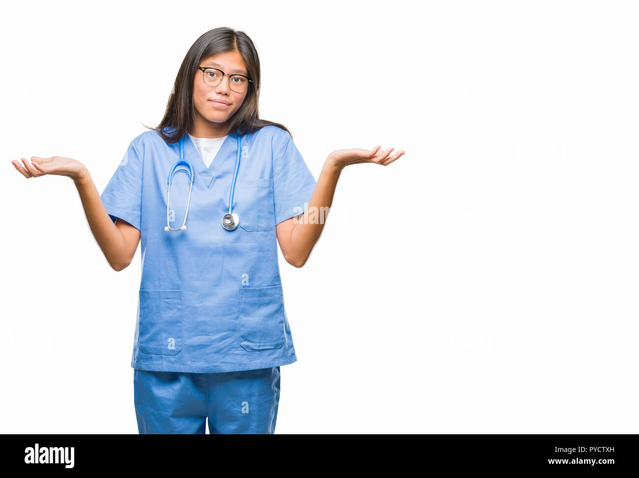 Young asian doctor woman over isolated background clueless and confused ...